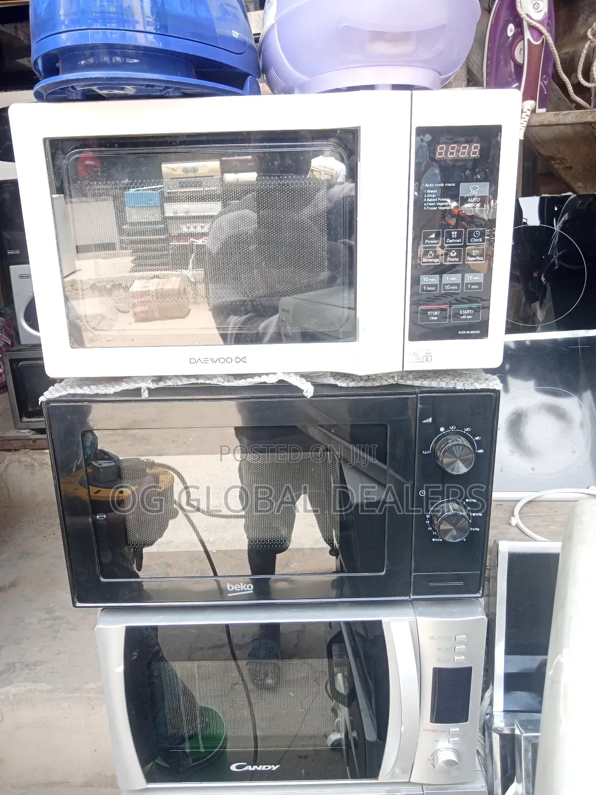Stack of Kitchen Microwave Ovens, Brands Like Daewoo, Beko, Candy. for ...